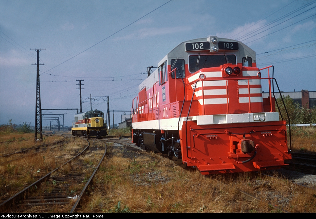 CB&Q 102, GE U25B, NEW, along with an Erie Lackawana 2509, U25B, at GE